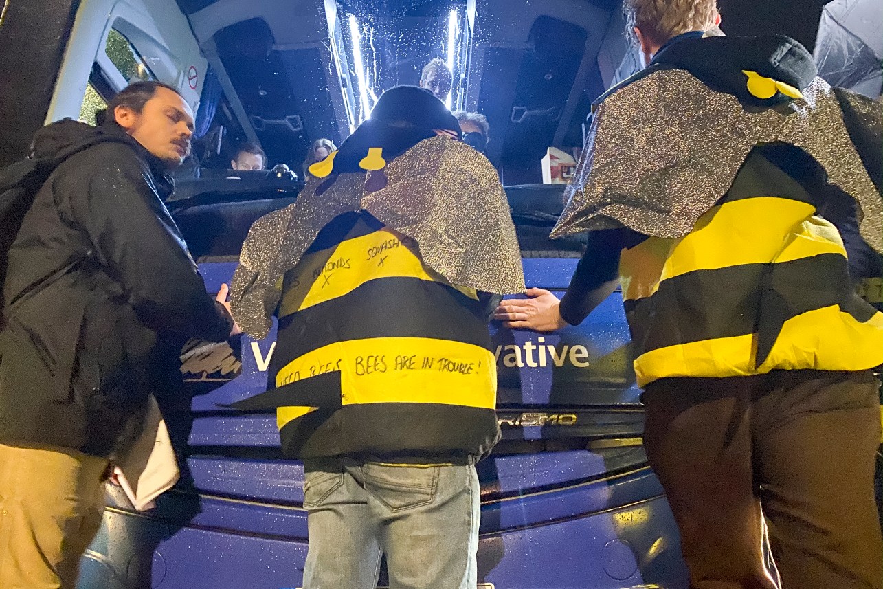 Extinction Rebellion UK glue themselves to Tory battle bus